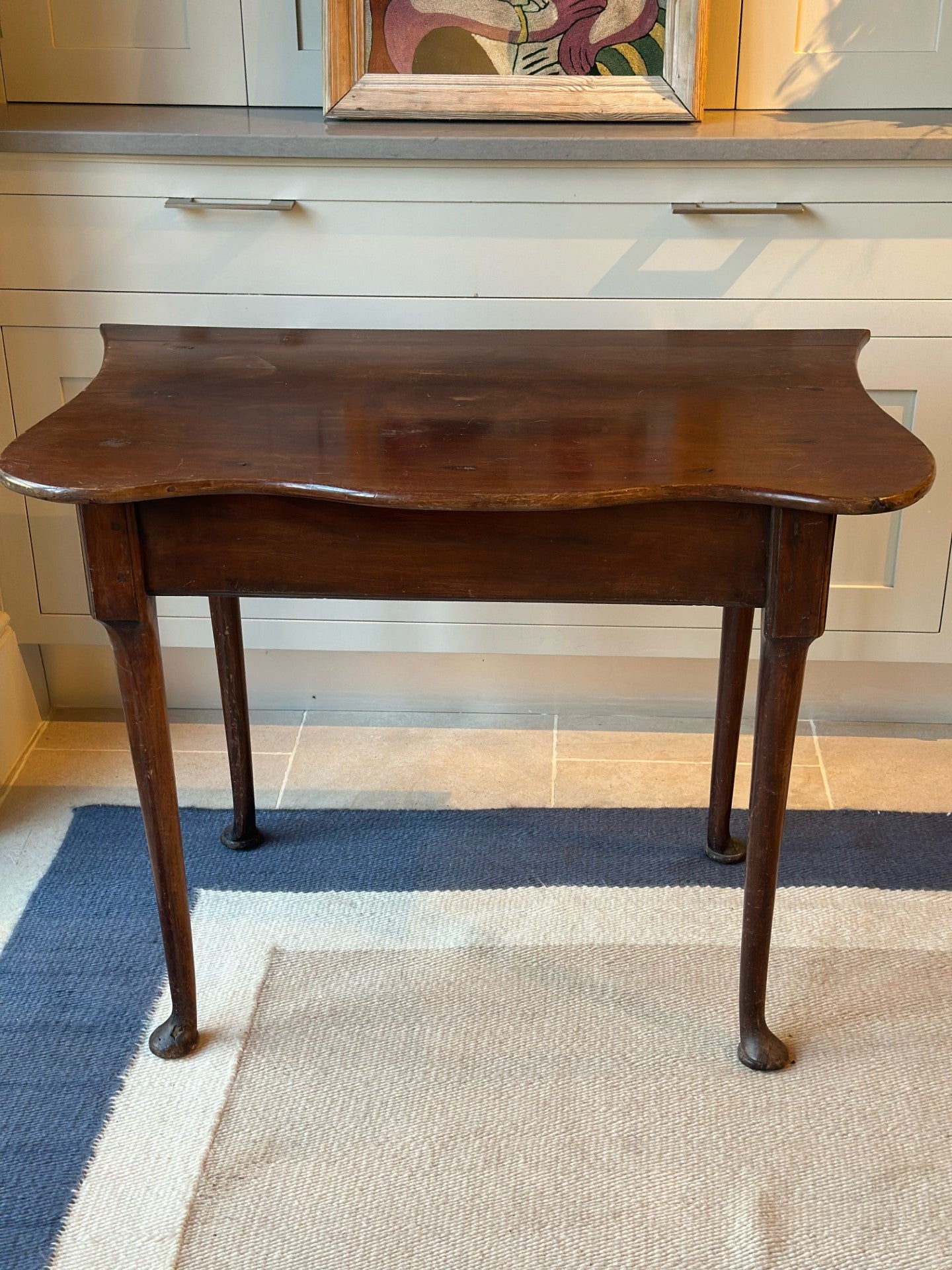 Serpentine Regency Mahogany Pad Foot Table